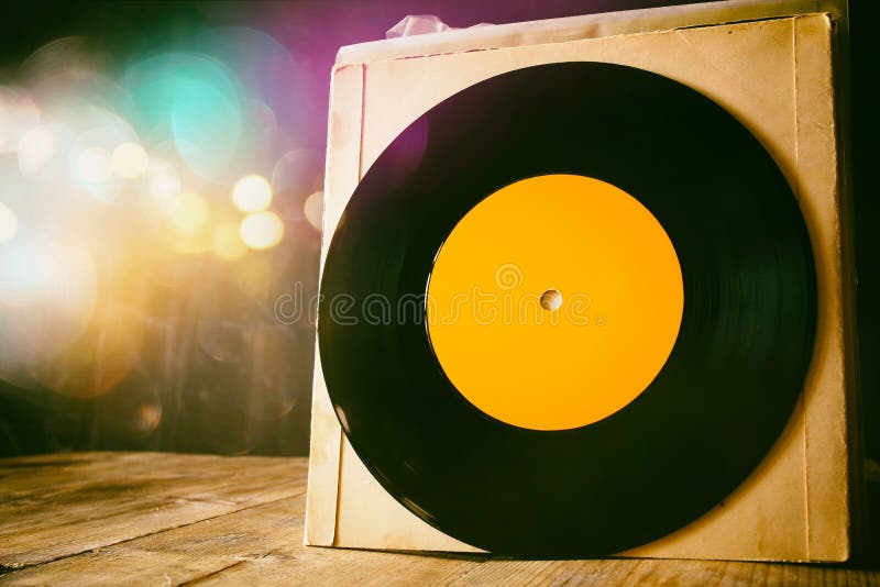 Old Records on Wooden Table with Glitter Background Stock Photo - Image ...