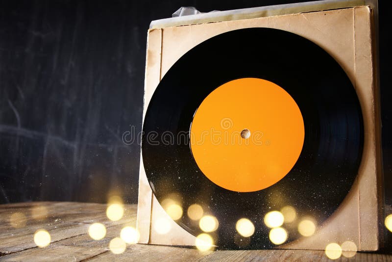 Old Records on Wooden Table with Glitter Background Stock Photo - Image ...