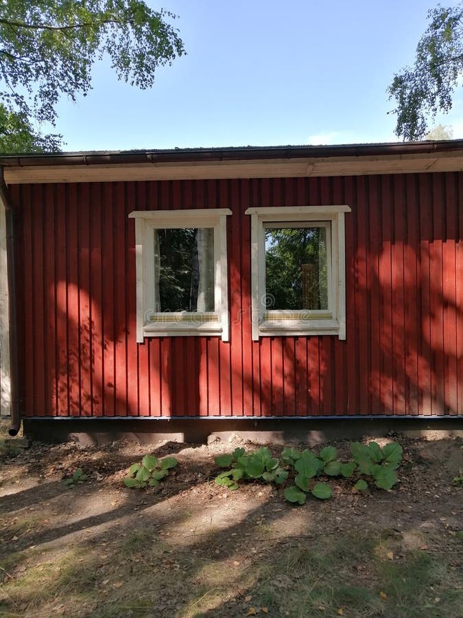 Old Red Barn with Green Plants in Front of it Stock Image - Image of ...