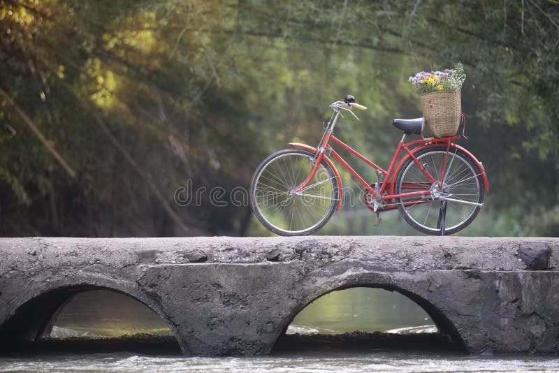 Red bicycle on old bridge stock image. Image of travel - 151281261