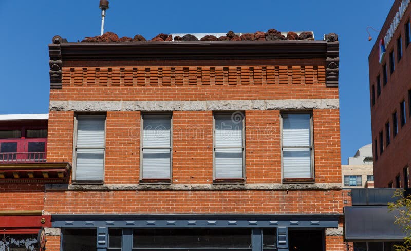 Old Red Brick Building with Shaded Windows Stock Photo - Image of urban ...