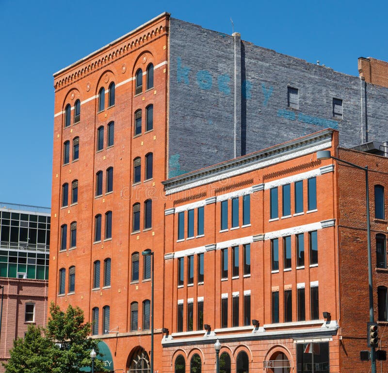 Old Red Brick Buildings with Blue Windows Under Clear Sky Stock Image ...