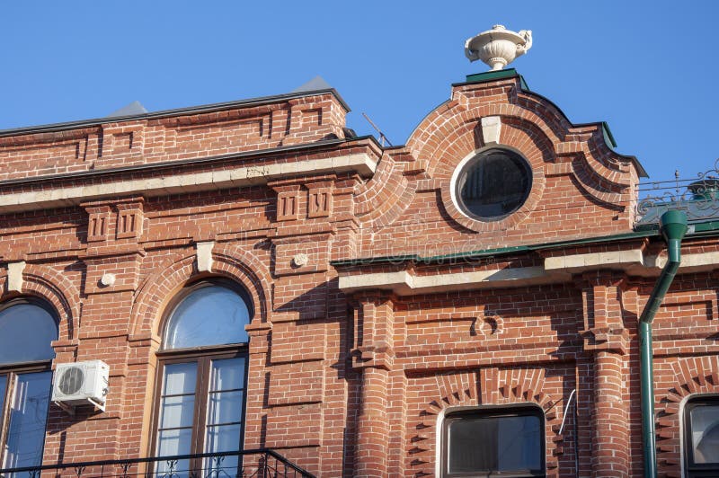 An Old Red Brick House with a Round Window Stock Image - Image of ...