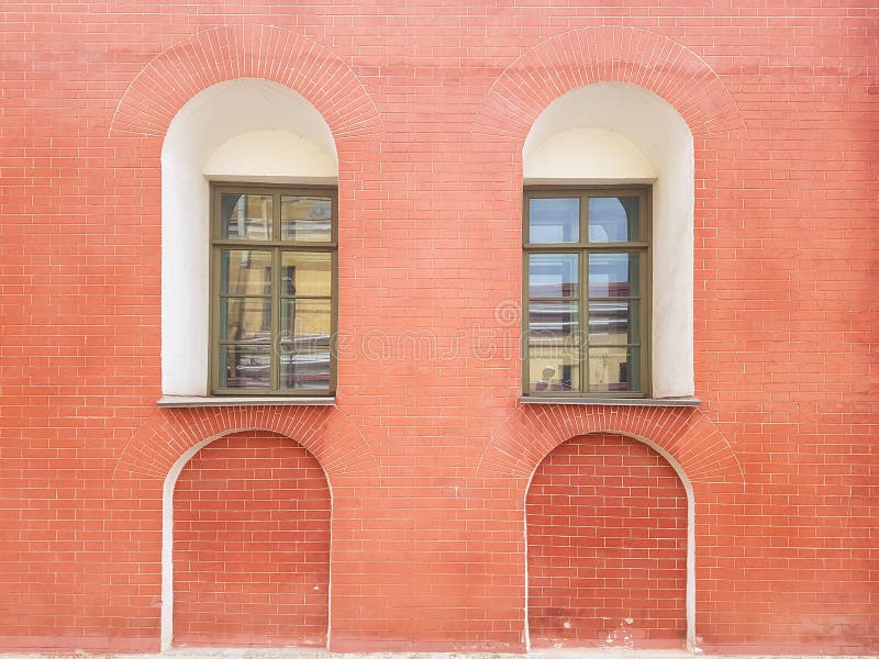 An Old Red Brick Wall and Two Green Windows on it Stock Image - Image ...