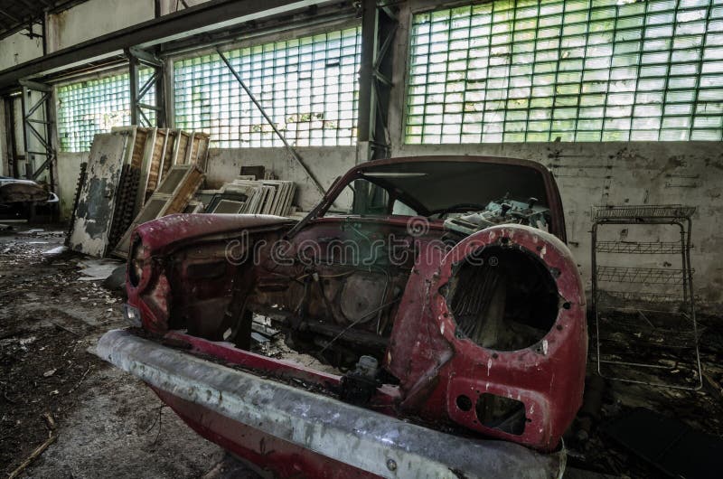 Old red car in workshop stock photo. Image of historical - 86986644