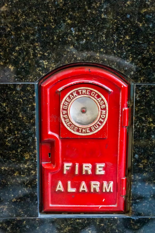 Old Red Fire Alarm Box Mounted on a Granite Wall with Instructions for ...