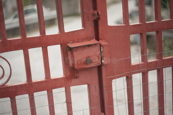 Old red iron gate stock photo. Image of bars, fear, gate - 161189016
