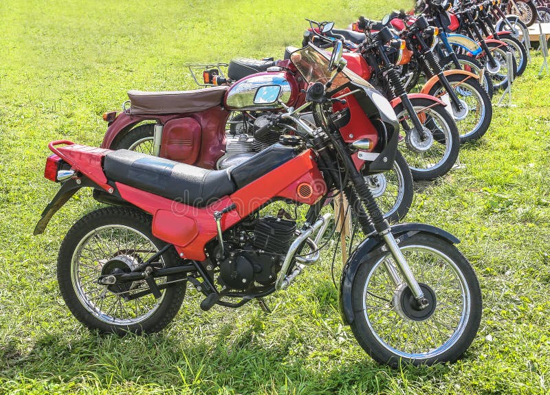 Old Red Motorcycles on Lawn Stock Photo - Image of reflection, retro ...