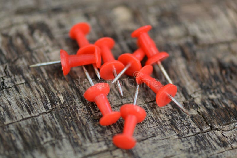 Old Red Pins on Wood Background Stock Image - Image of group, business ...