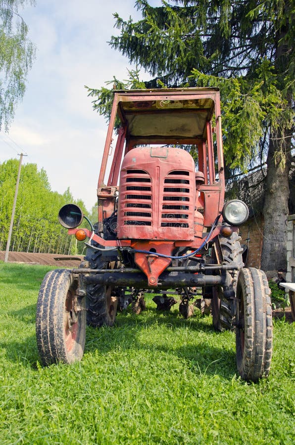 Old Red Tractor on Grass in Farm Stock Photo - Image of field ...