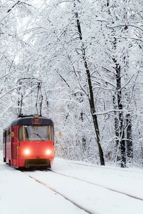 Old Red Tram Rides through the Snowy Forest. Winter Plot Stock Image ...