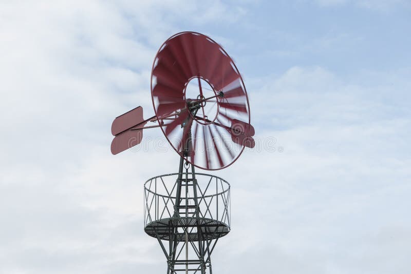 Old red windmill spinning stock photo. Image of progress - 169840192