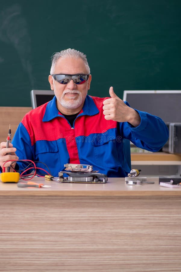 Old Repairman Repairing Computers in the Classroom Stock Image - Image ... Old Repairman Repairing Computers in the Classroom Stock Image - Image ...