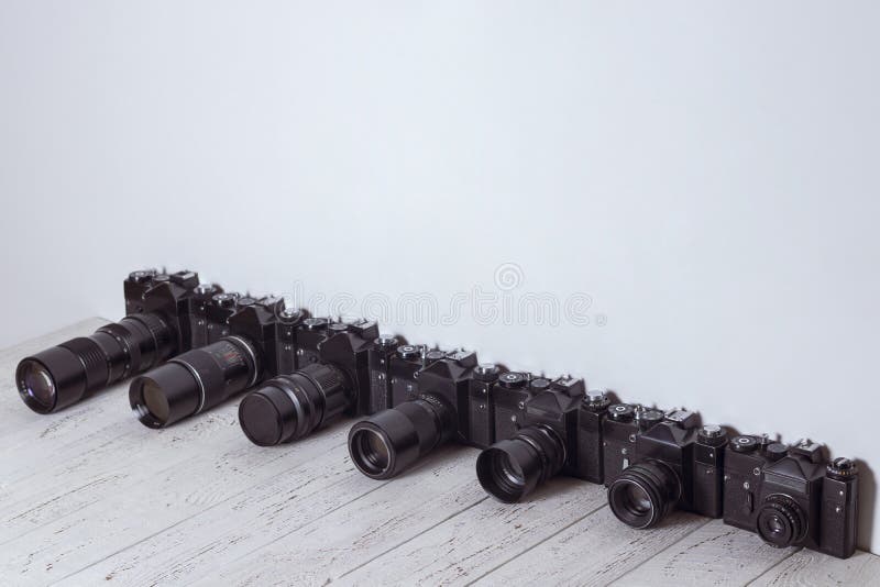 Old Retro Cameras with Different Lenses are on the Table Stock Photo ...