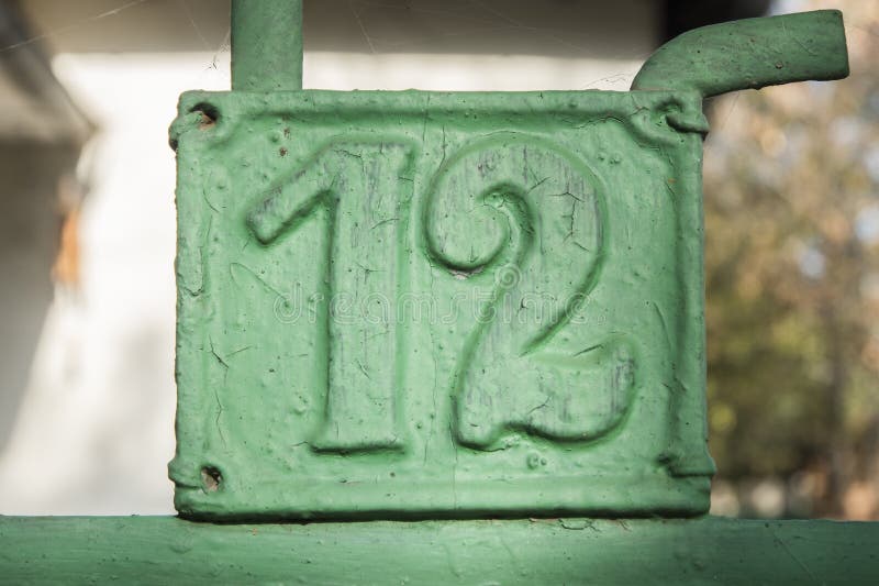 Old Retro Cast Iron Plate Number 12 Stock Photo - Image of numeral ...