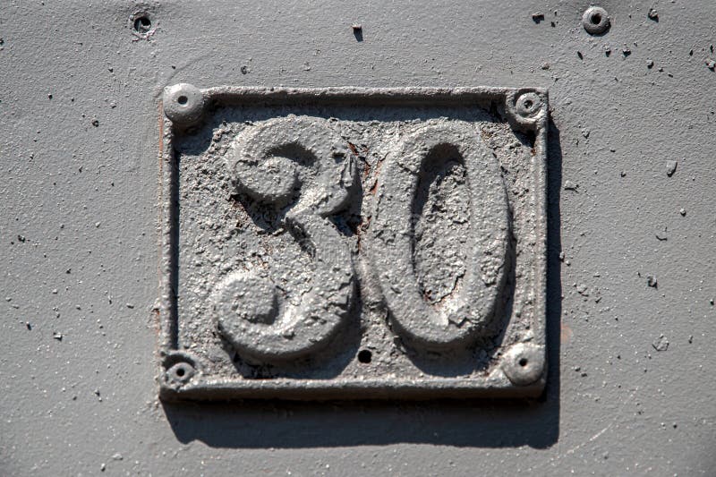 Weathered Iron Plate with Number 30 on White Stock Photo - Image of ...