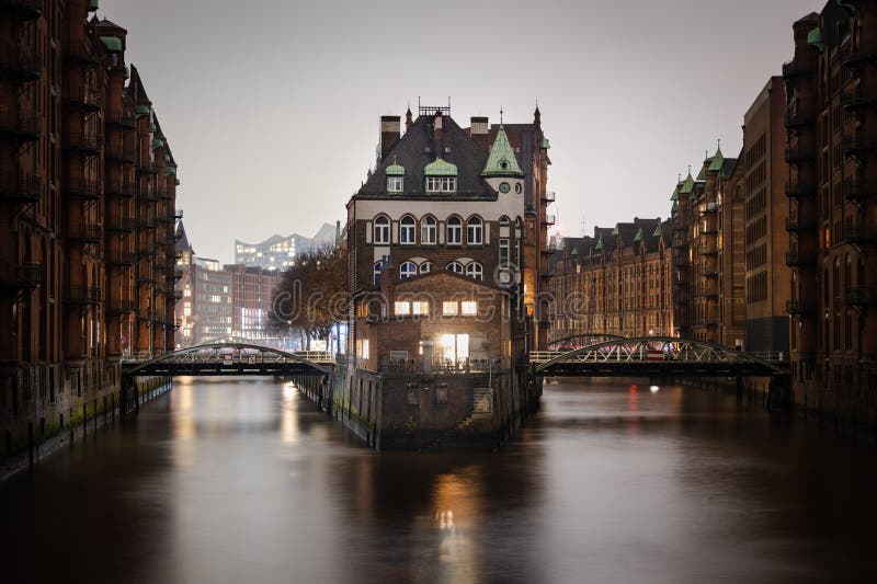 An Old River that is in Front of Buildings and a Bridge Stock Photo ...