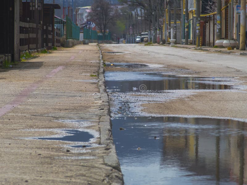 Old Road with Puddles by the Roadside Stock Image - Image of road, rain ...