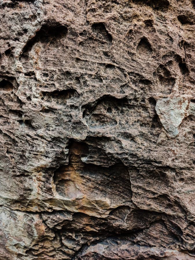 An Old Rock with Cracks and Potholes. Natural Stone Surface Stock Photo ...