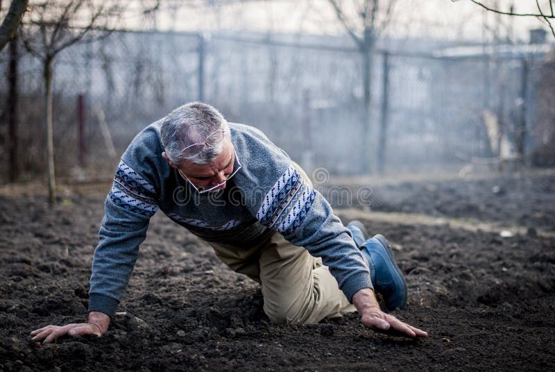 Old Romanian Man Working His Land in a Traditional Way with Empty Hands ...