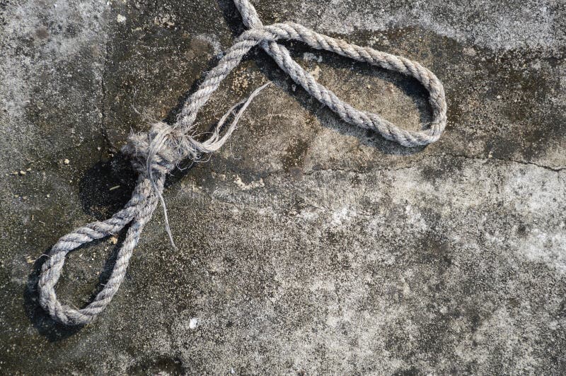 Old rope on cement floor stock photo. Image of concrete - 79614230