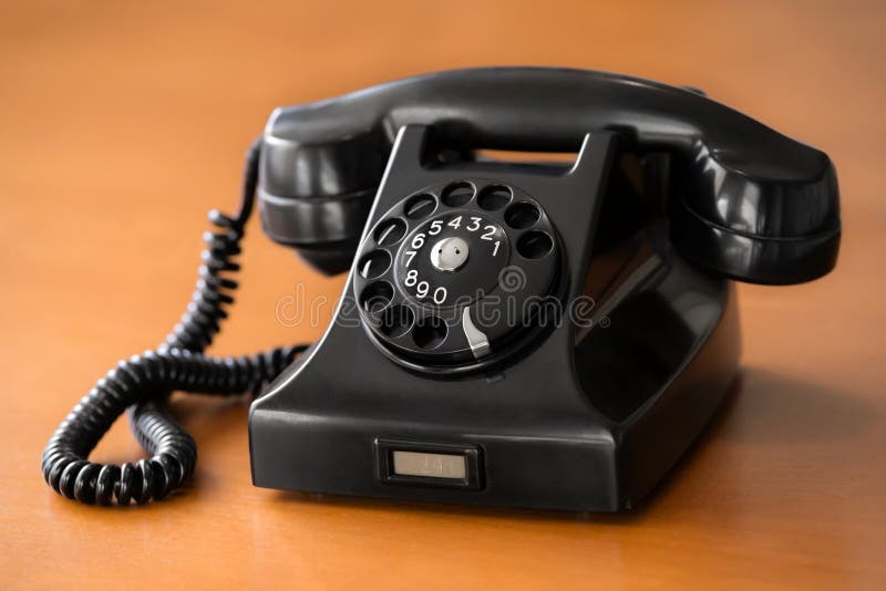 Old Rotary Dial Phone on Wooden Desk Stock Photo - Image of phone ...