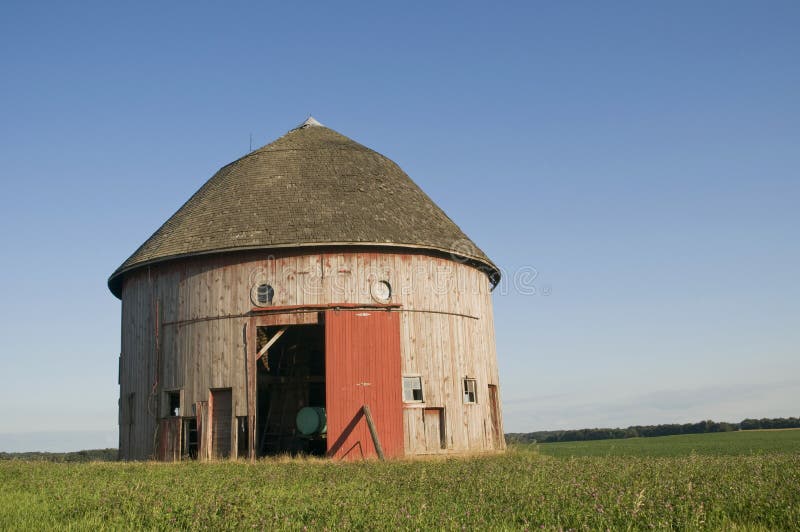 Old round barn in field stock image. Image of structure - 10737797