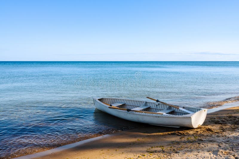 Old Row Boat on Beach with Shadow of Trees. Stock Image - Image of ...