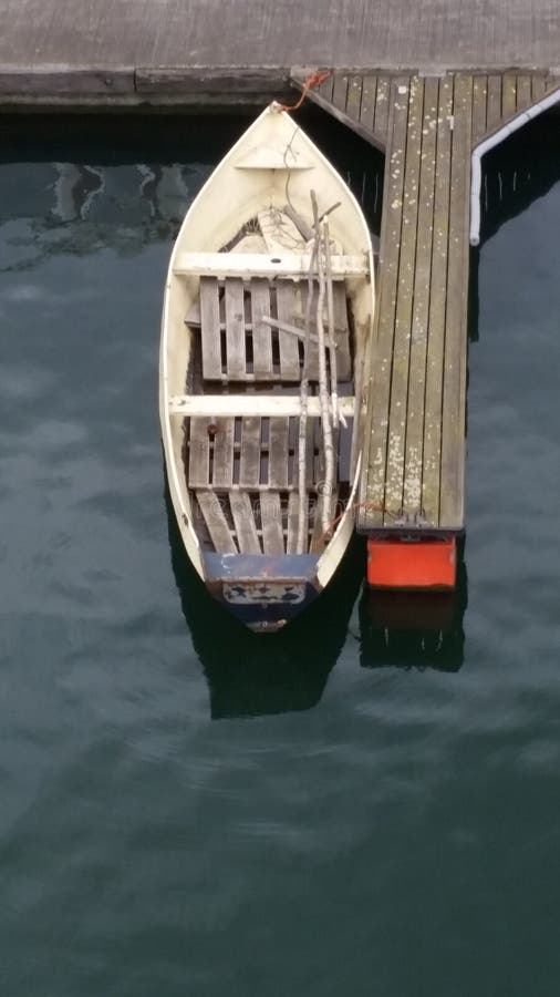 Old rowing boat at pier stock photo. Image of harbor - 91206732
