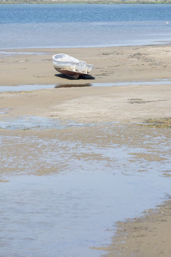 Old Rowing Boat on Sandy Wet Beach Stock Photo - Image of seascape ...