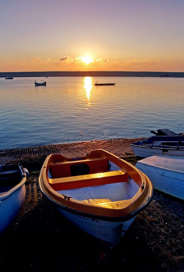 Old Rowing Boat with Oars on Sea during Sunset Stock Image - Image of ...