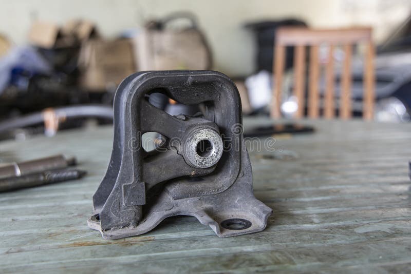 Old Rubber Engine Mount with Tools on the Table Background Stock Image ...