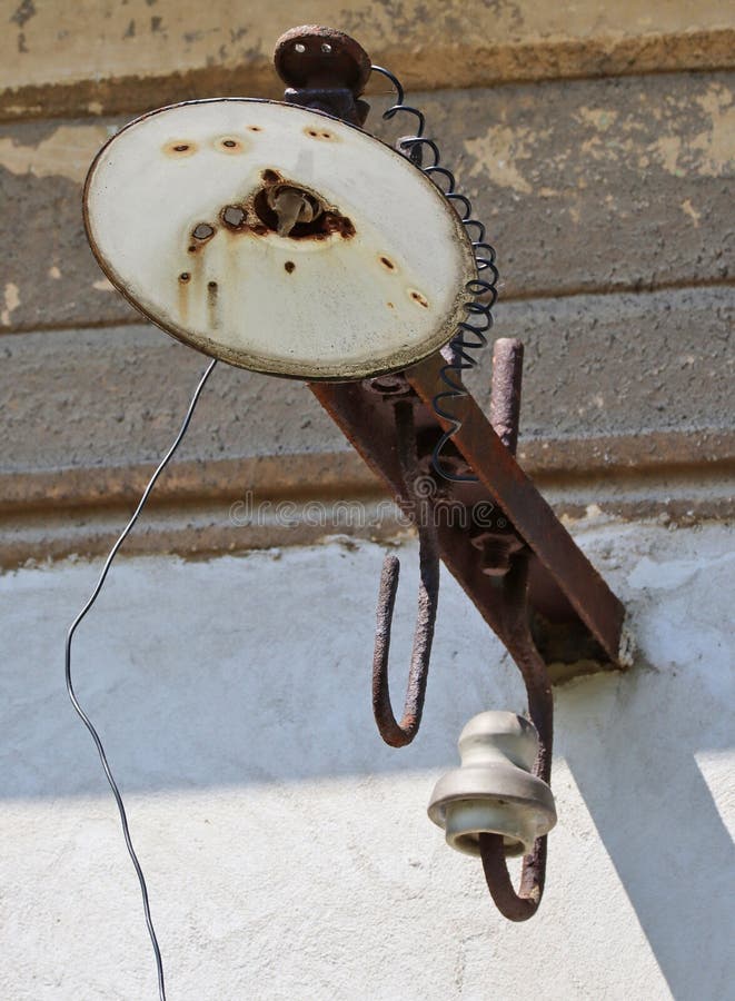 Old Ruined Damaged Lamp on the Wall of a House Stock Image - Image of ...