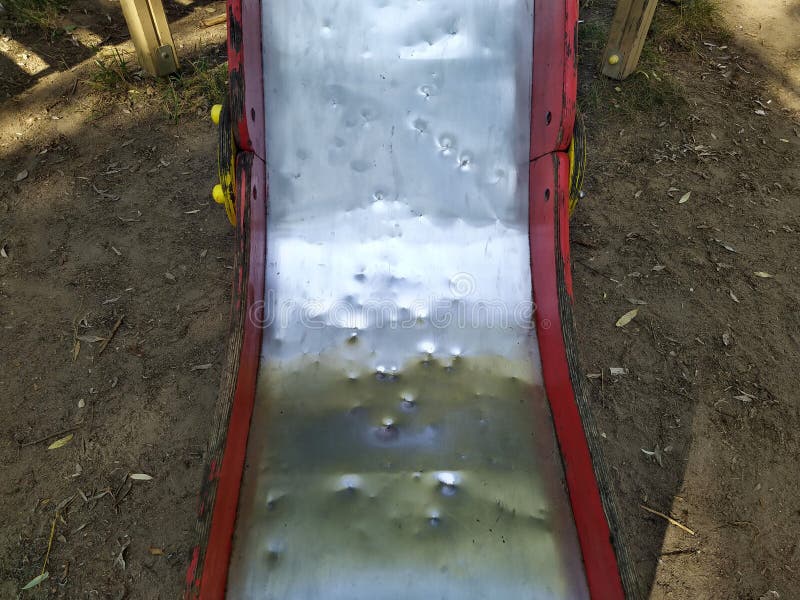 Old and Rumpled Slide on the Playground. Stock Image - Image of ...