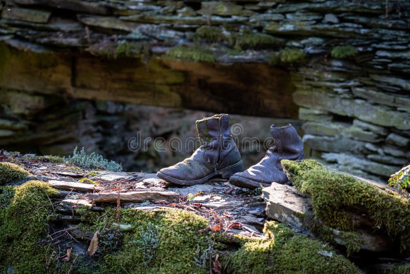 Old Run-down Boots with Moss Over the Wall Stock Photo - Image of ...