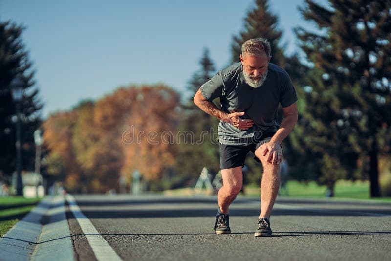 The Old Runner Feeling Bad while Jogging. Stock Photo - Image of active ...