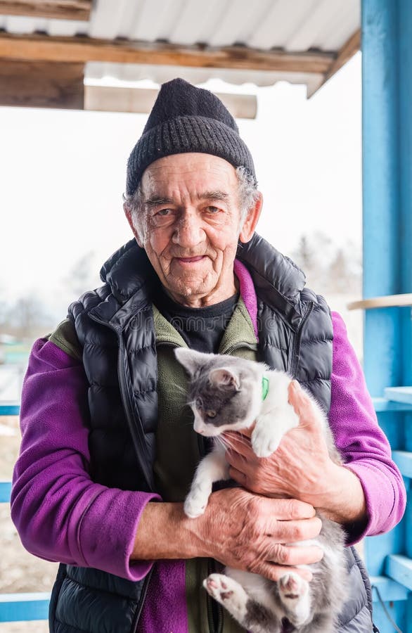 Old Russian Man Holding His Cat and Smiling Stock Image - Image of ...