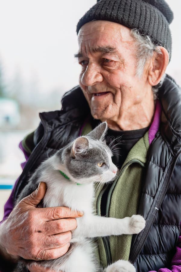 Old Russian Man Holding His Cat and Smiling Stock Image - Image of ...
