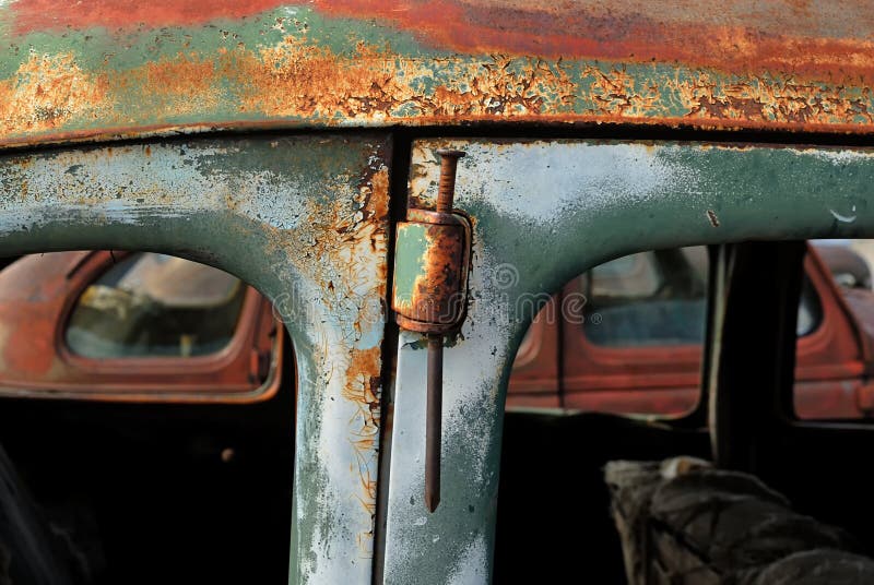 Using a Spike As a Hinge Pin in an Old Rusty Car. Stock Photo - Image ...