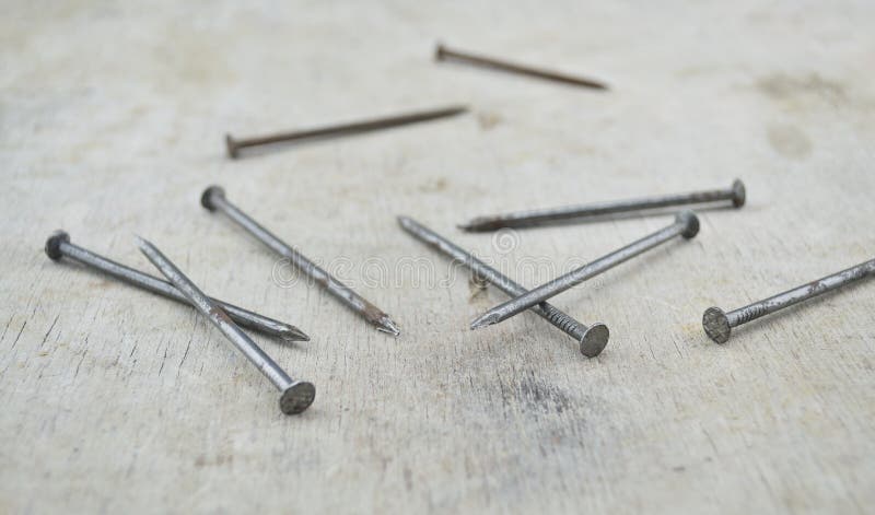 Old Rust Metal Nails on Wood Board Stock Photo - Image of construction ...