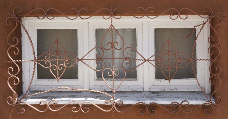 Old Rust Window with Styled Iron Grid Stock Photo - Image of window ...