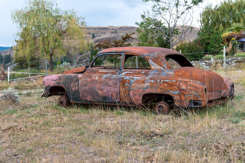 Old Rusted Abandoned Antique Car in a Field Stock Image - Image of ...