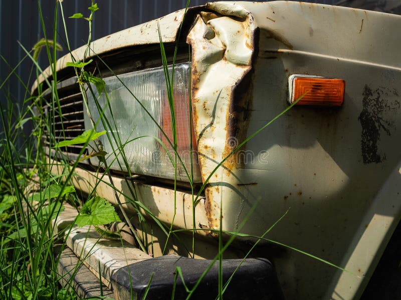 Old Rusted Car. Broken Car in the Green Grass Stock Image - Image of ...