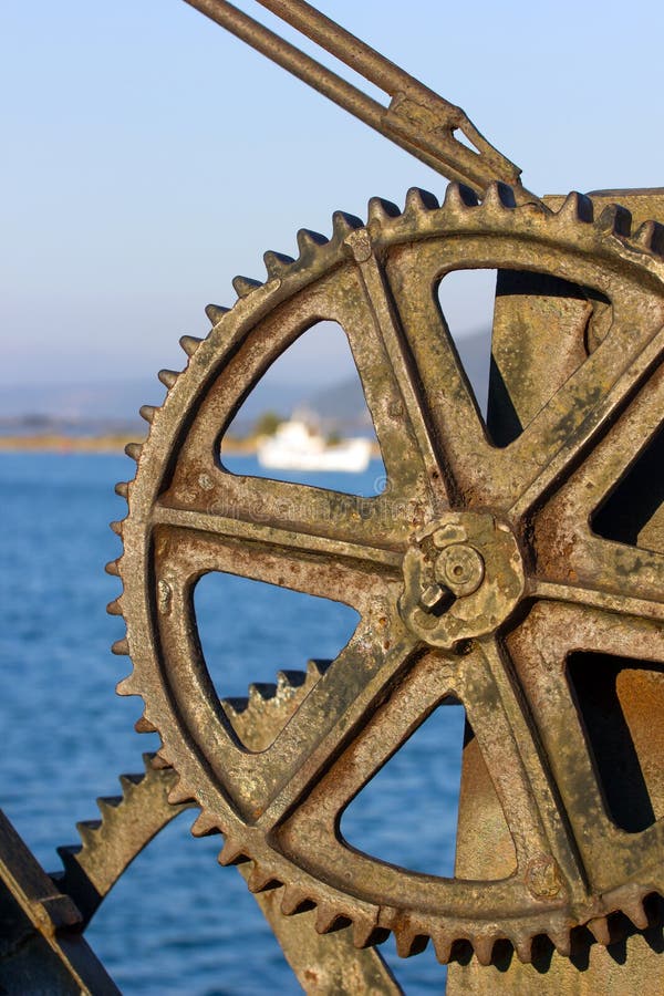 Old rusted gear in a port stock photo. Image of blur - 40299718