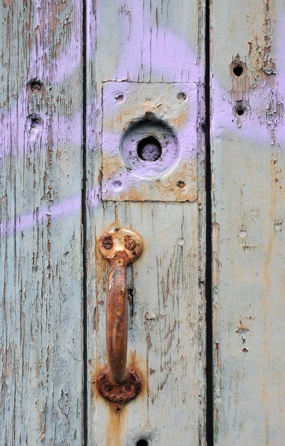 Old Rusted Iron Door Handle on a Green Painted Wooden Door Stock Image ...