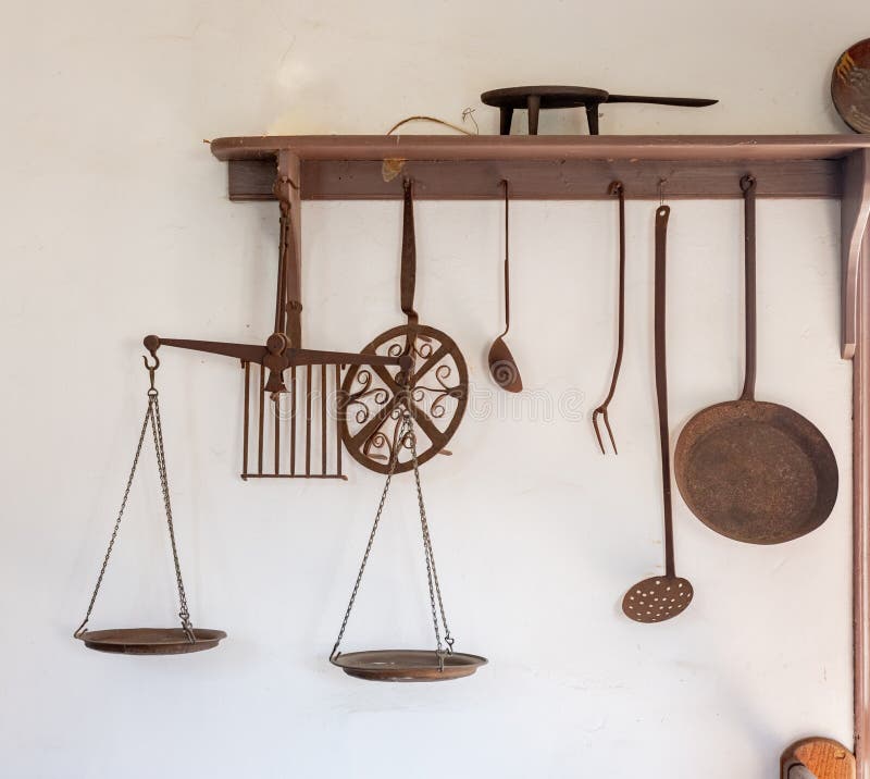 Old Rusted Kitchen Utensils Hanging on a Rack Stock Photo - Image of ...
