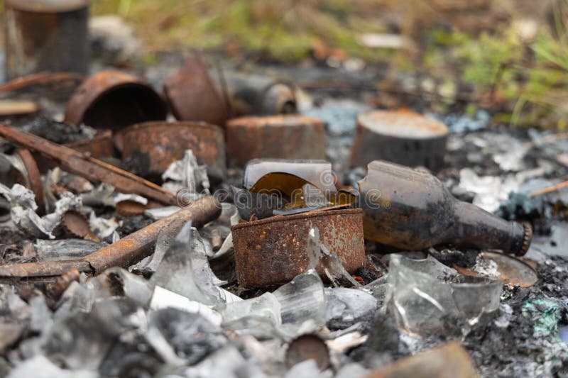 Old, Rusted Metal Cans in Burned Ash. Trash in Abandoned Army Base ...