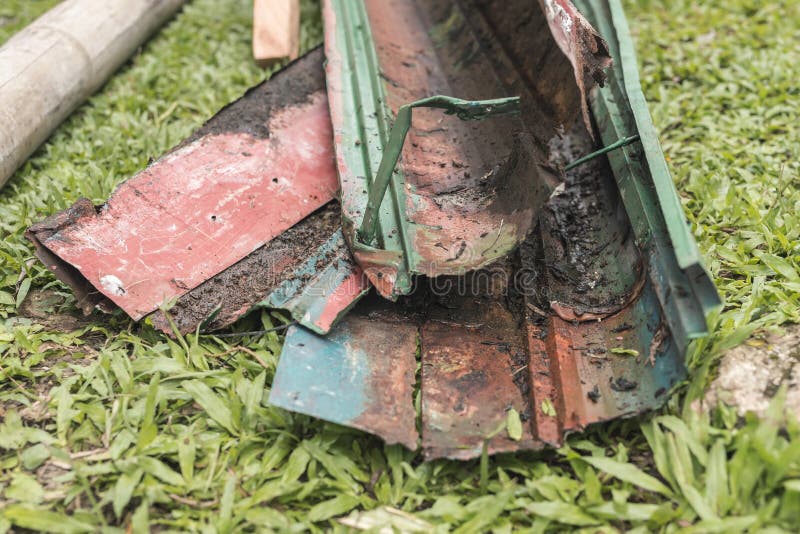 Old and Rusted Metal Gutters Stripped Off and Laying on the Ground ...