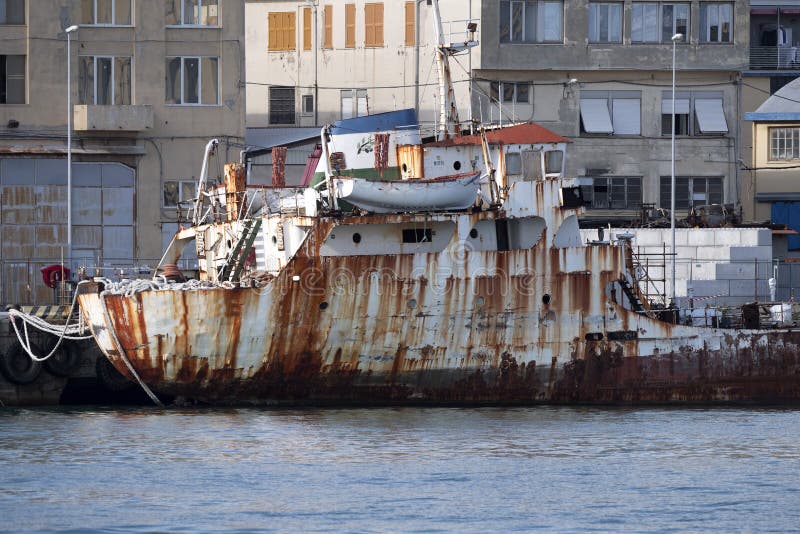 Old rusted ship in harbor editorial image. Image of crash - 218395490