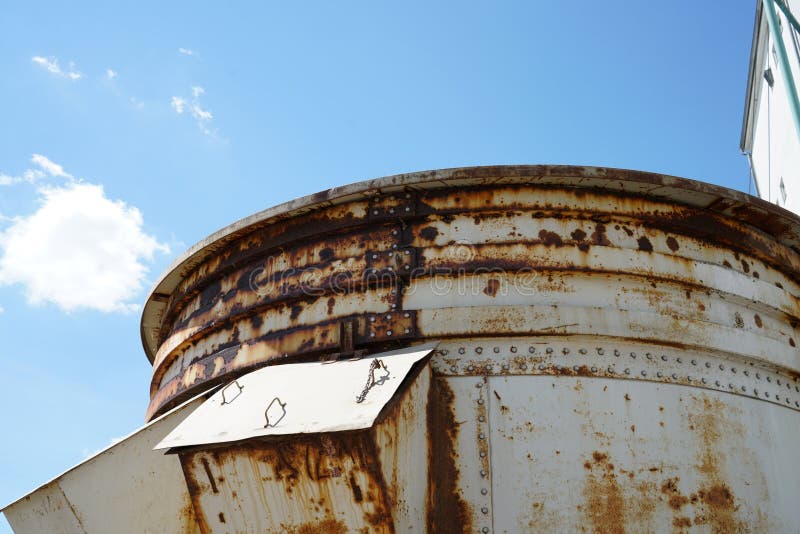 An Old Rusted Silo Photographed in a Port Area in Summer Stock Photo ...